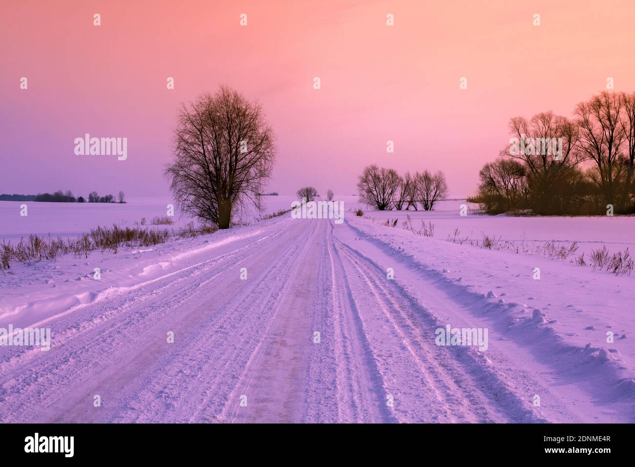 Rural winter landscape at dawn. Country road covered with snow Stock ...