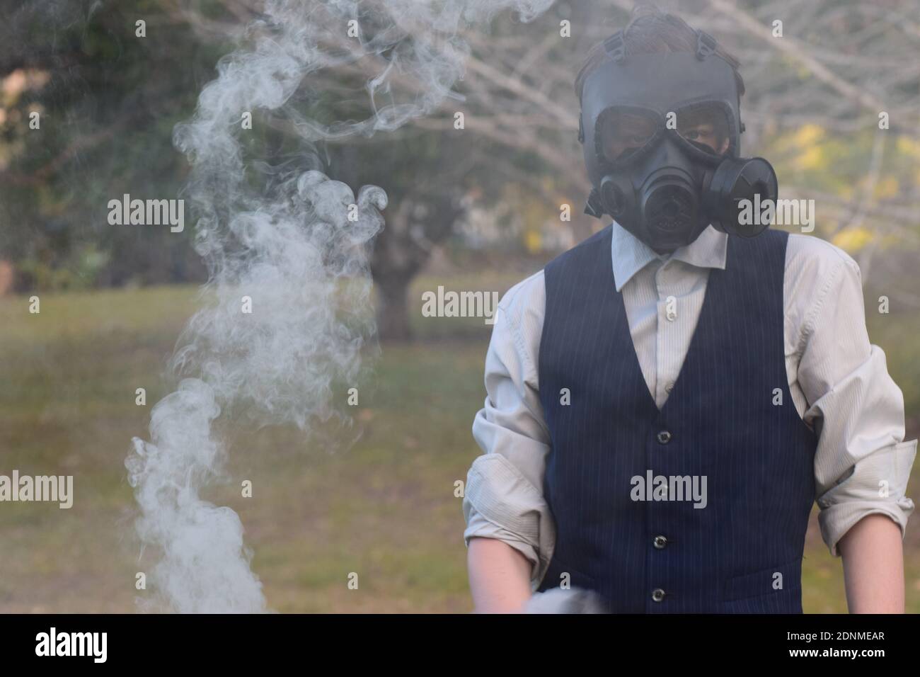 Teenage Boy Wearing Gas Mask While Standing Against Trees Stock Photo ...