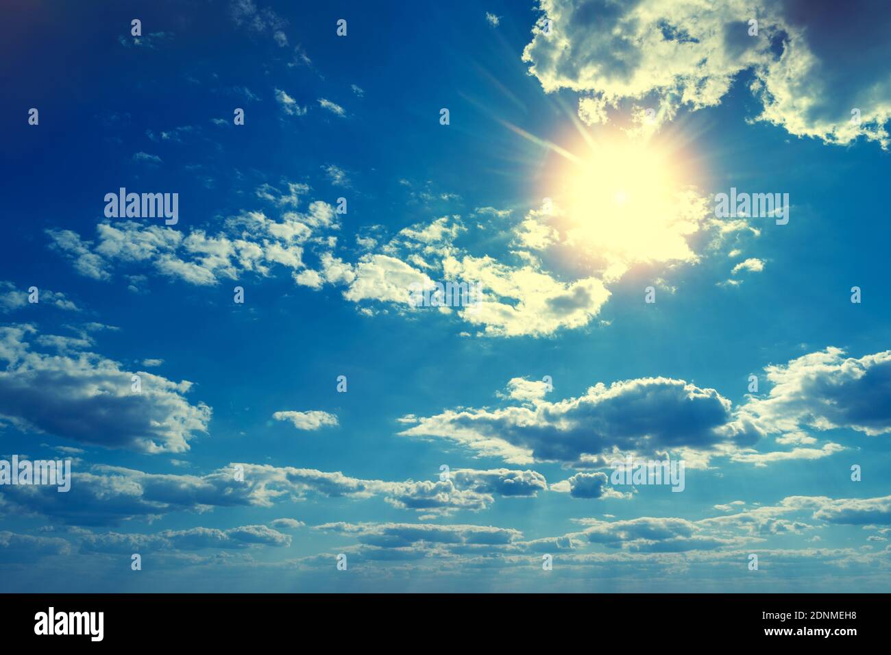 Blue cloudy sky on a sunny day. Sun on the sky. Sky texture, abstract ...