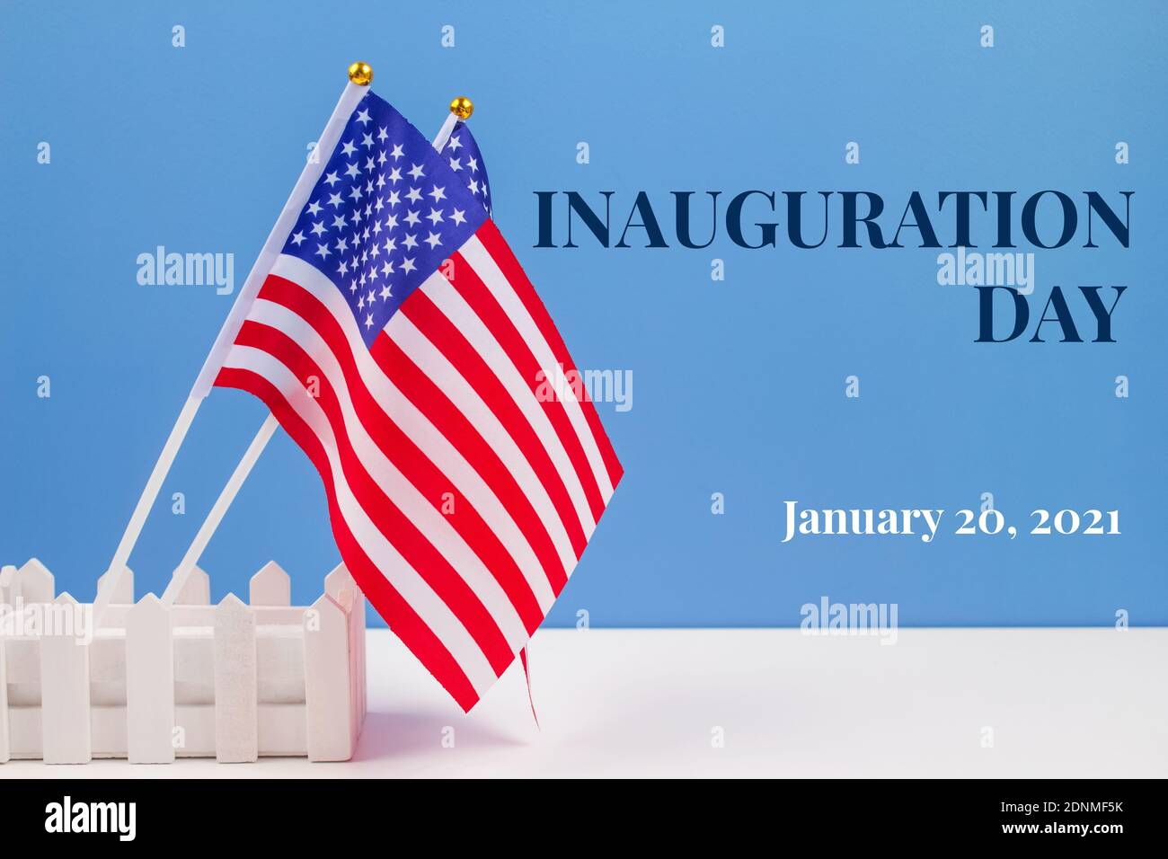 USA flags on white table with blue wall background, copyspace for your ...