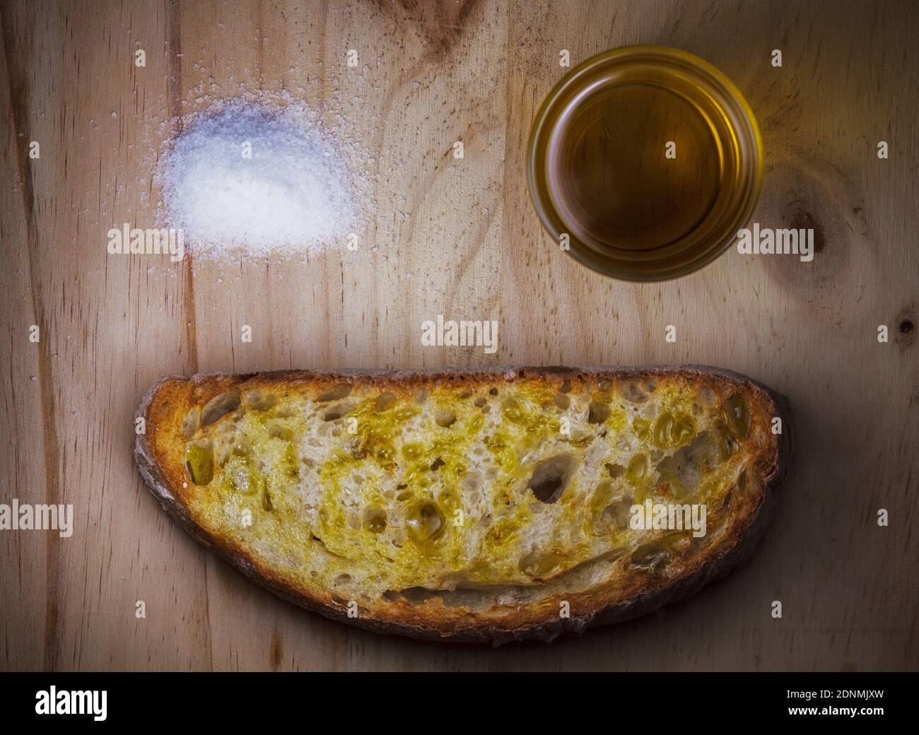 A high angle shot of a Mediterranean breakfast: toasted bread with oil ...