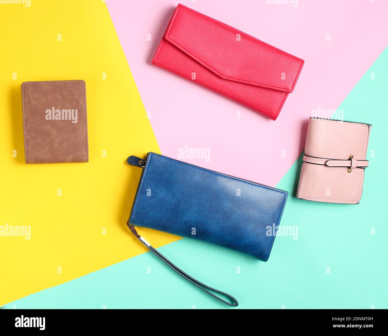 Many leather purses on a colored pastel background. Top View Stock ...