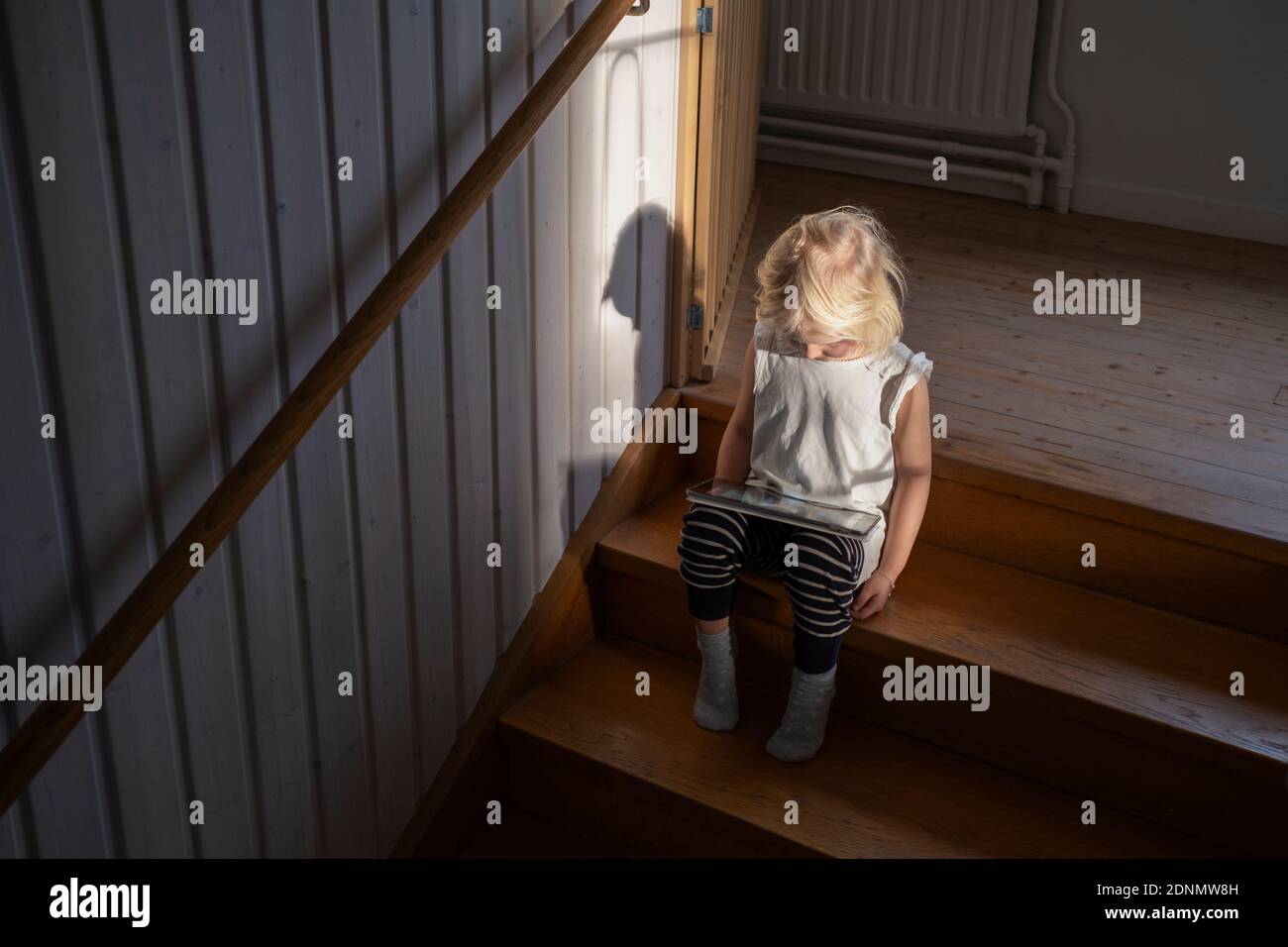 Girl using digital tablet Stock Photo - Alamy