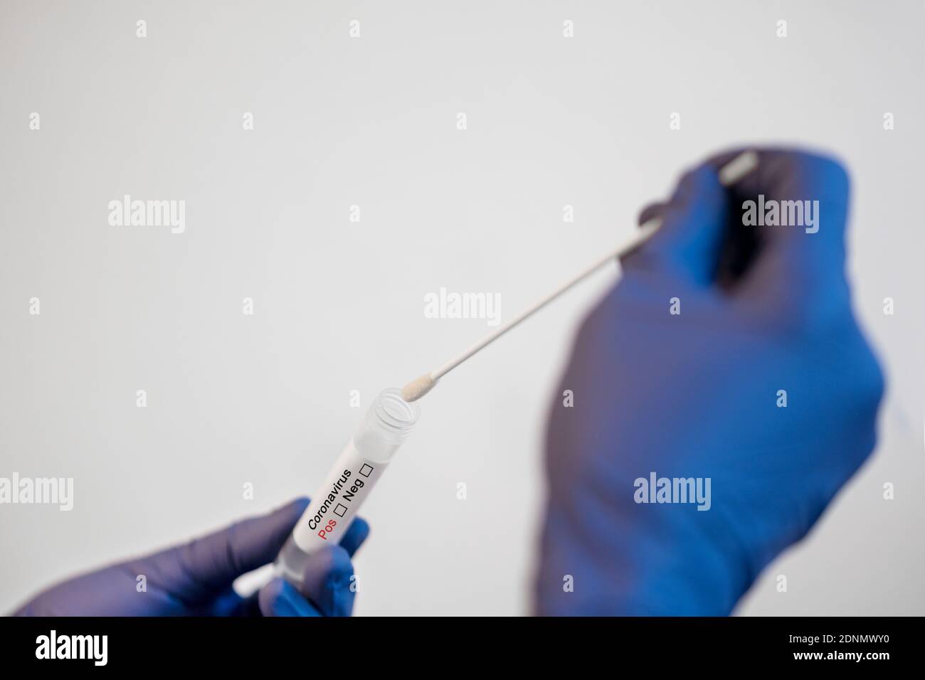 Hand holding test tube Stock Photo - Alamy