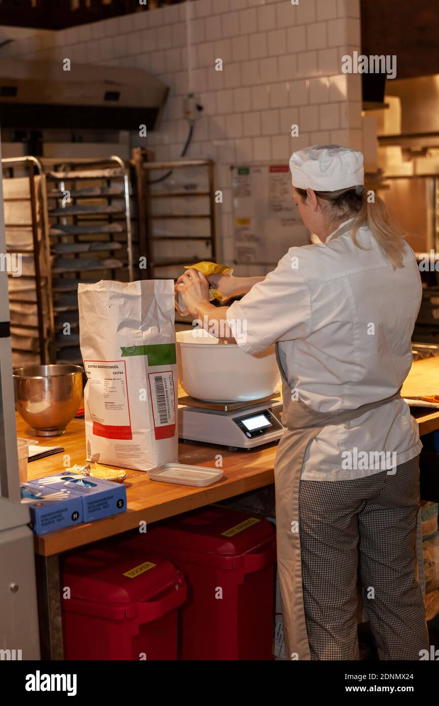 Female baker in commercial bakery Stock Photo - Alamy
