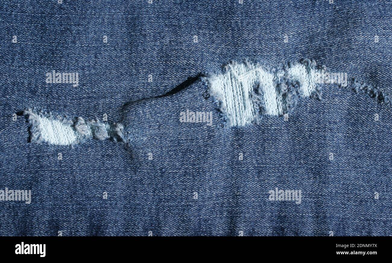Texture of torn worn jeans Stock Photo - Alamy