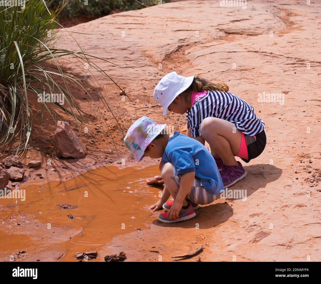 Boys playing in mud hi-res stock photography and images - Alamy