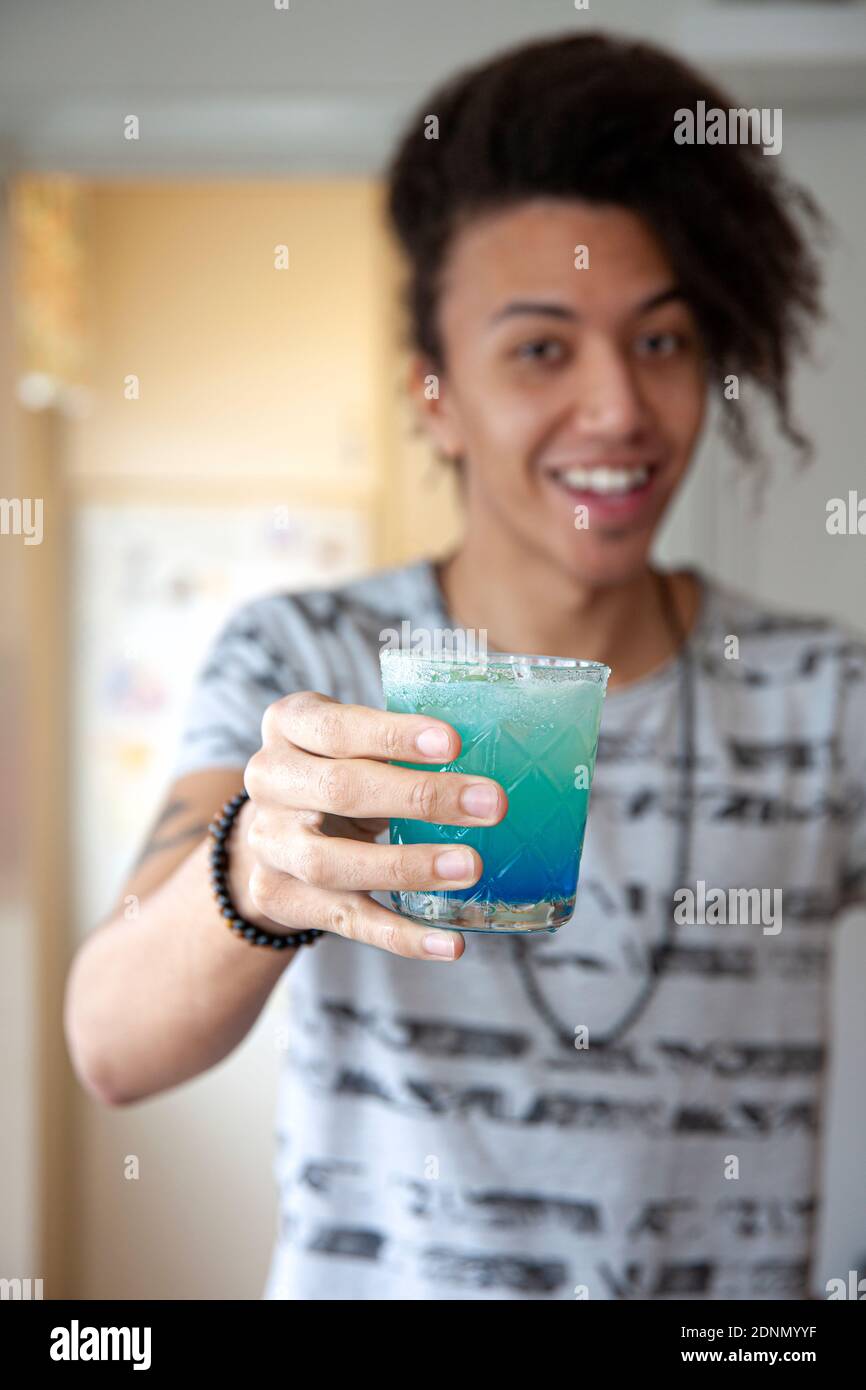 Man holding drink Stock Photo - Alamy