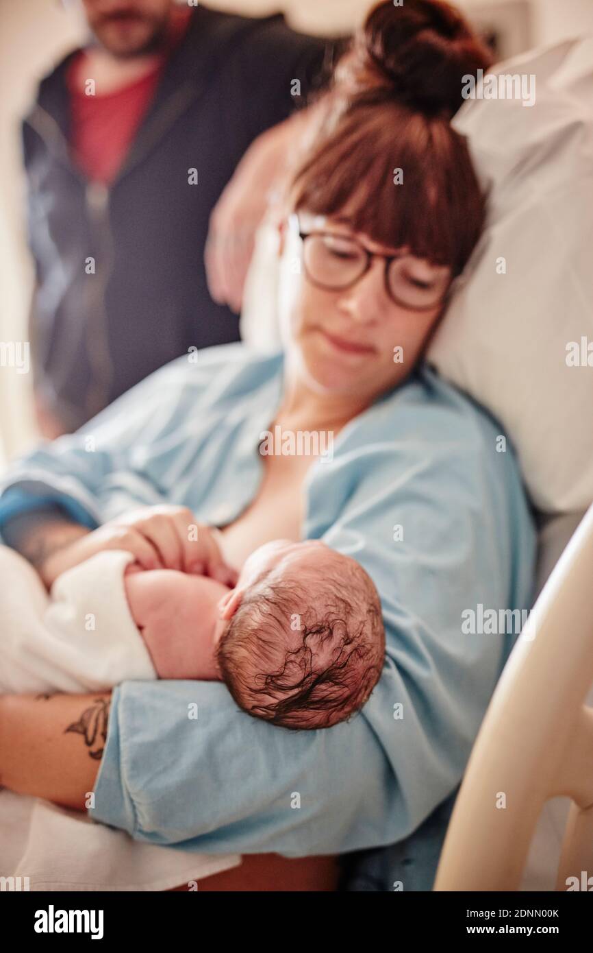 Mother holding newborn baby Stock Photo - Alamy