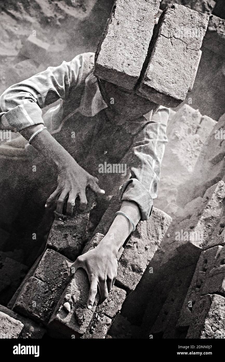 Construction worker carrying bricks hi-res stock photography and images ...