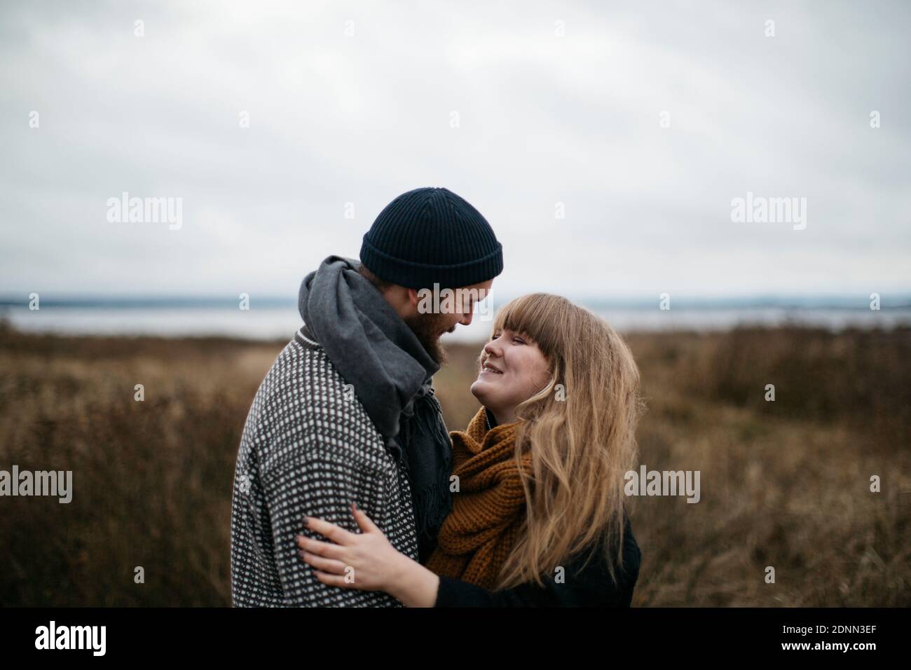 Couple standing together Stock Photo - Alamy