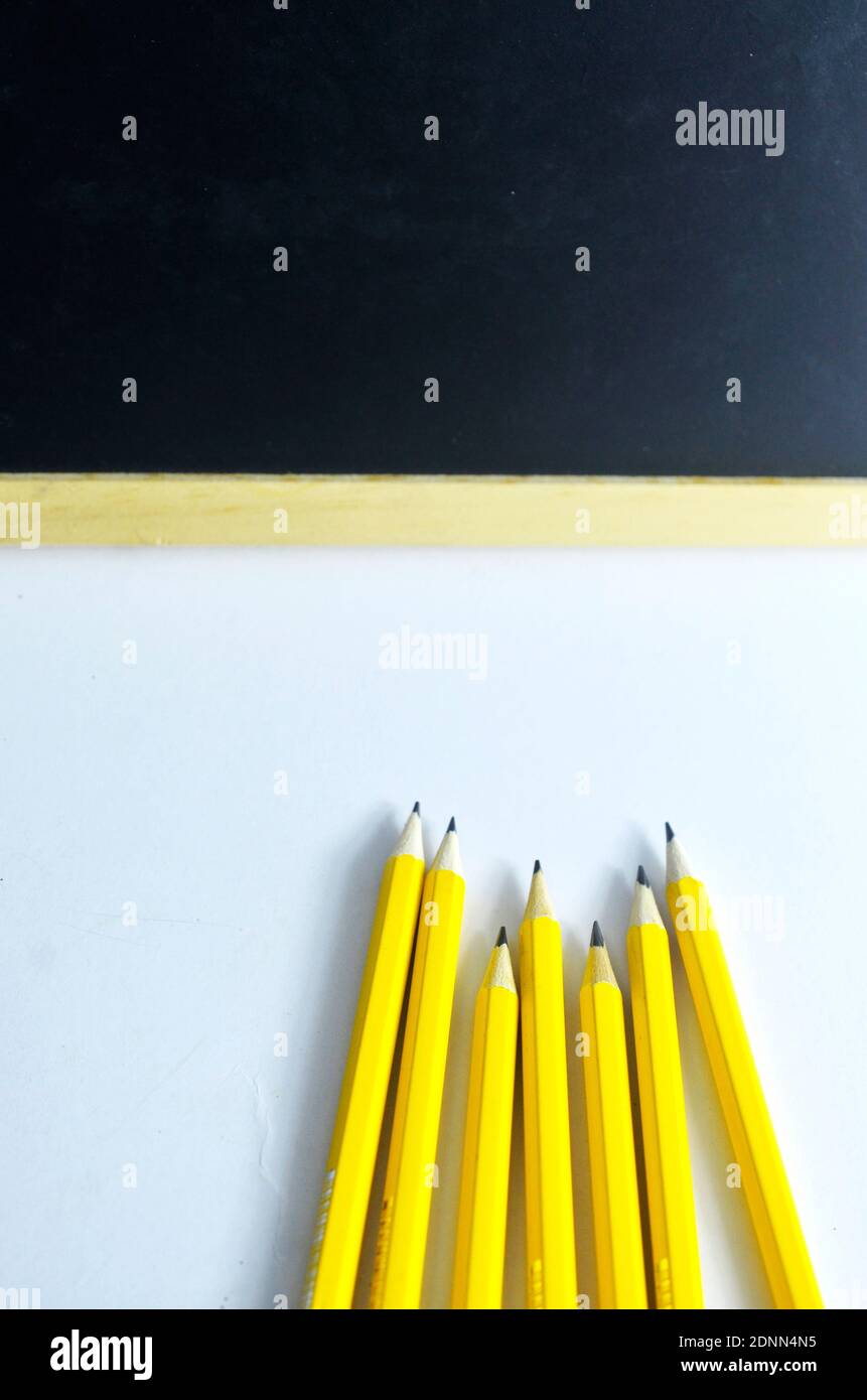 Yellow Pencil On Whitw Board Background Stock Photo - Alamy