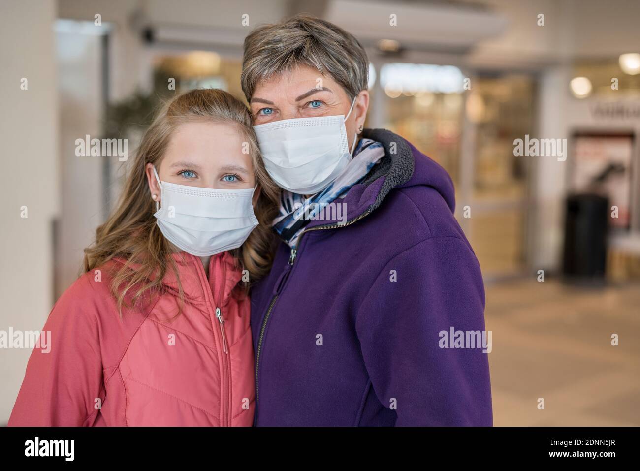 Mother and daughter wearing protective masks Stock Photo - Alamy