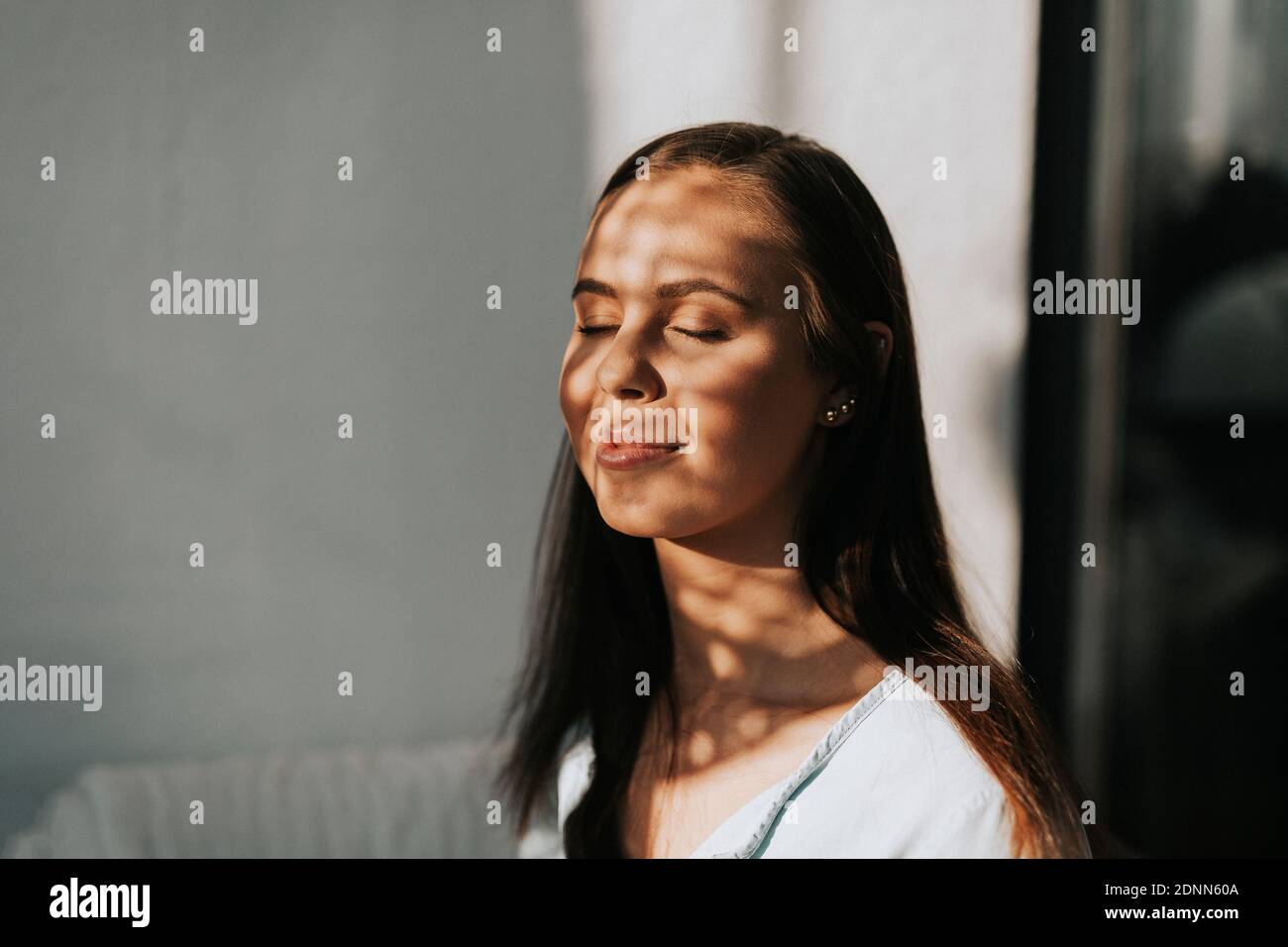 Woman relaxing with her eyes closed Stock Photo - Alamy