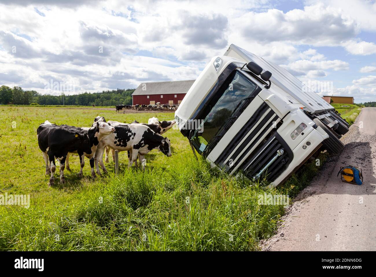 Overturned lorry on road side Stock Photo - Alamy