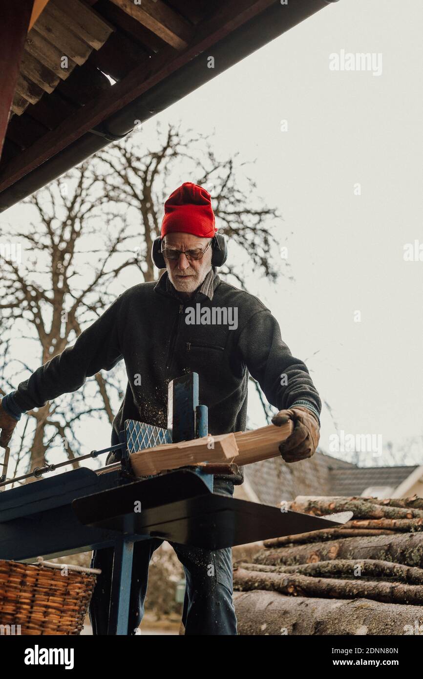 Woman sawing wood hi-res stock photography and images - Alamy