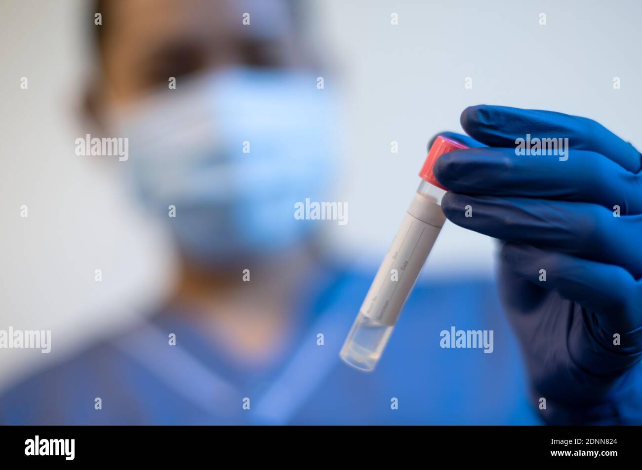 Scientist holding medical sample in test tube Stock Photo - Alamy