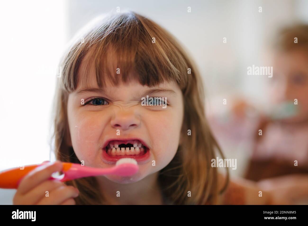 Girl brushing teeth Stock Photo - Alamy