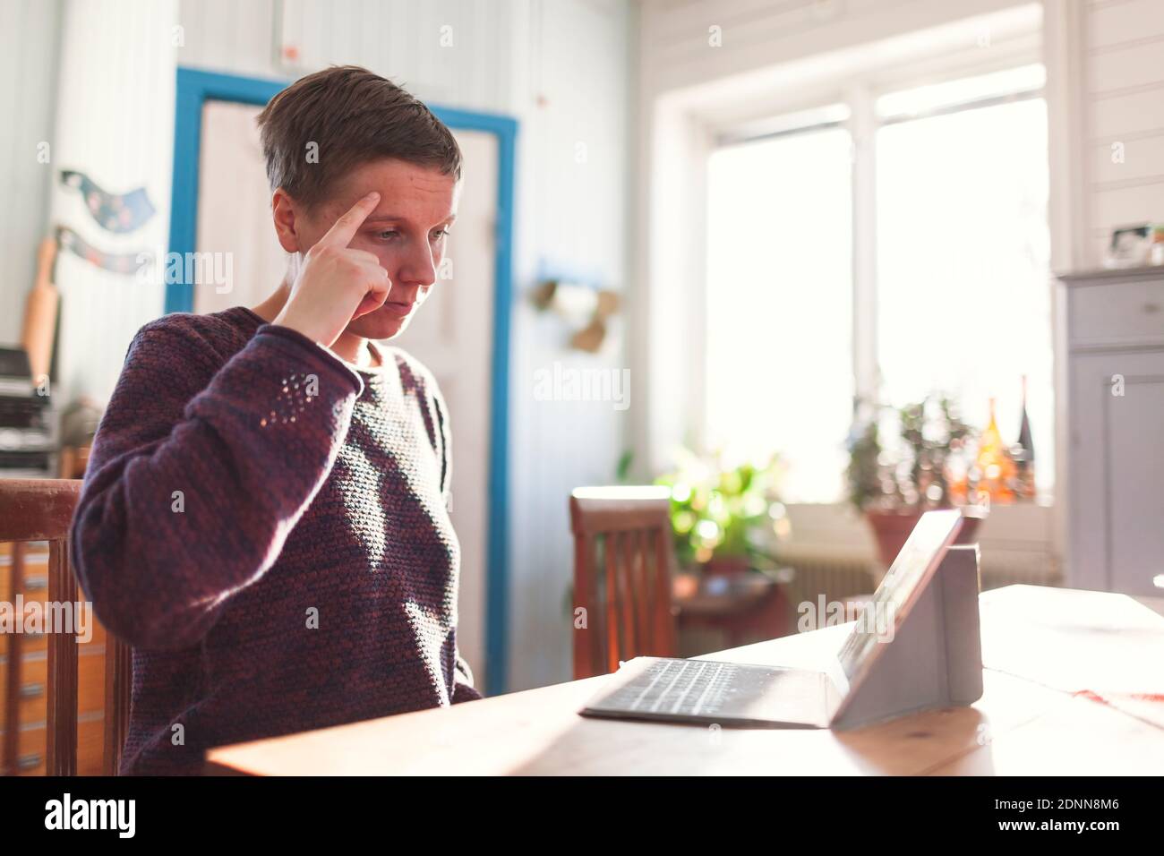 Woman having sign language conversation via video call on computer ...