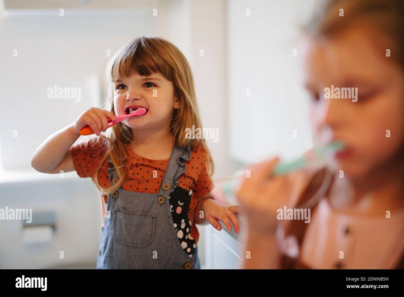 Girl brushing teeth Stock Photo - Alamy