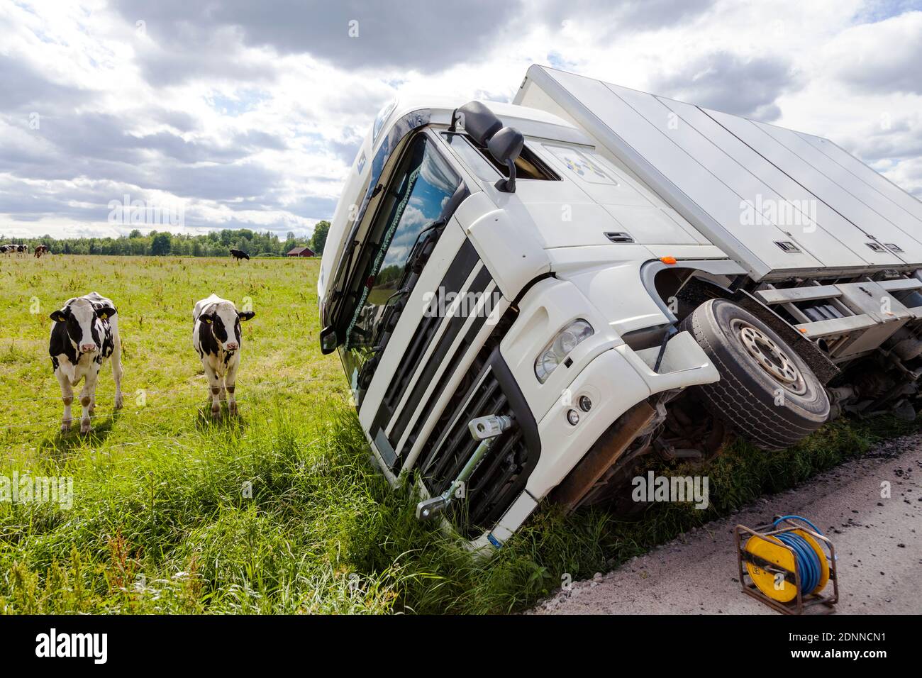 Overturned lorry on road side Stock Photo - Alamy