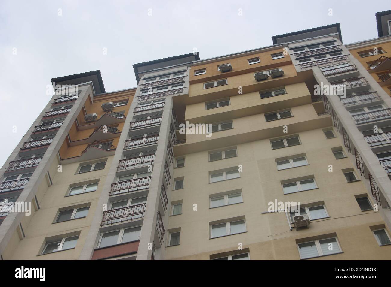 Top of apartment building, view from the ground Stock Photo - Alamy