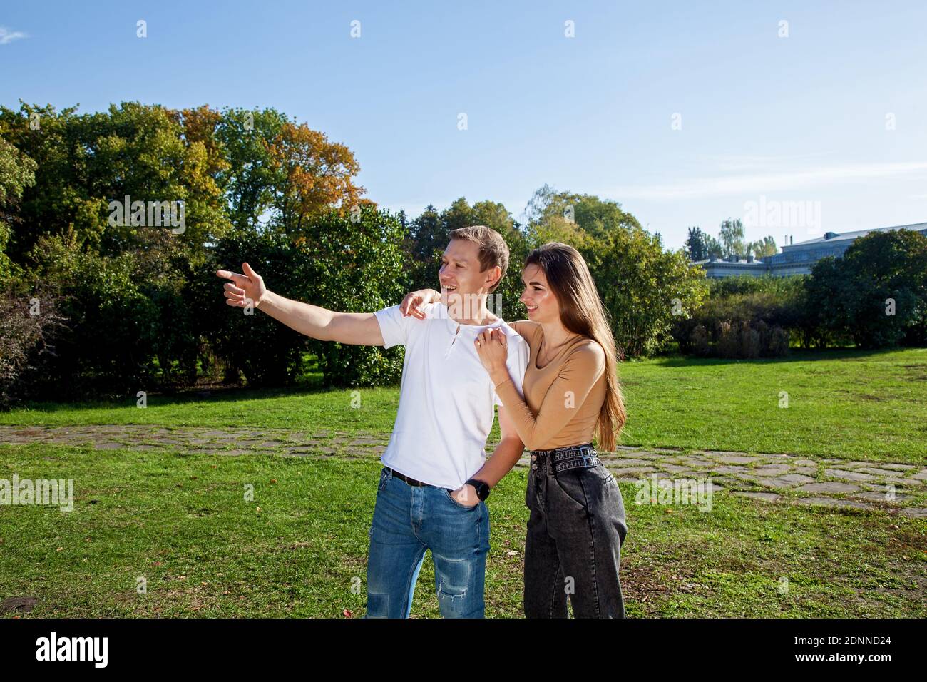 Couple in love in a good mood having fun in the autumn park. Young ...