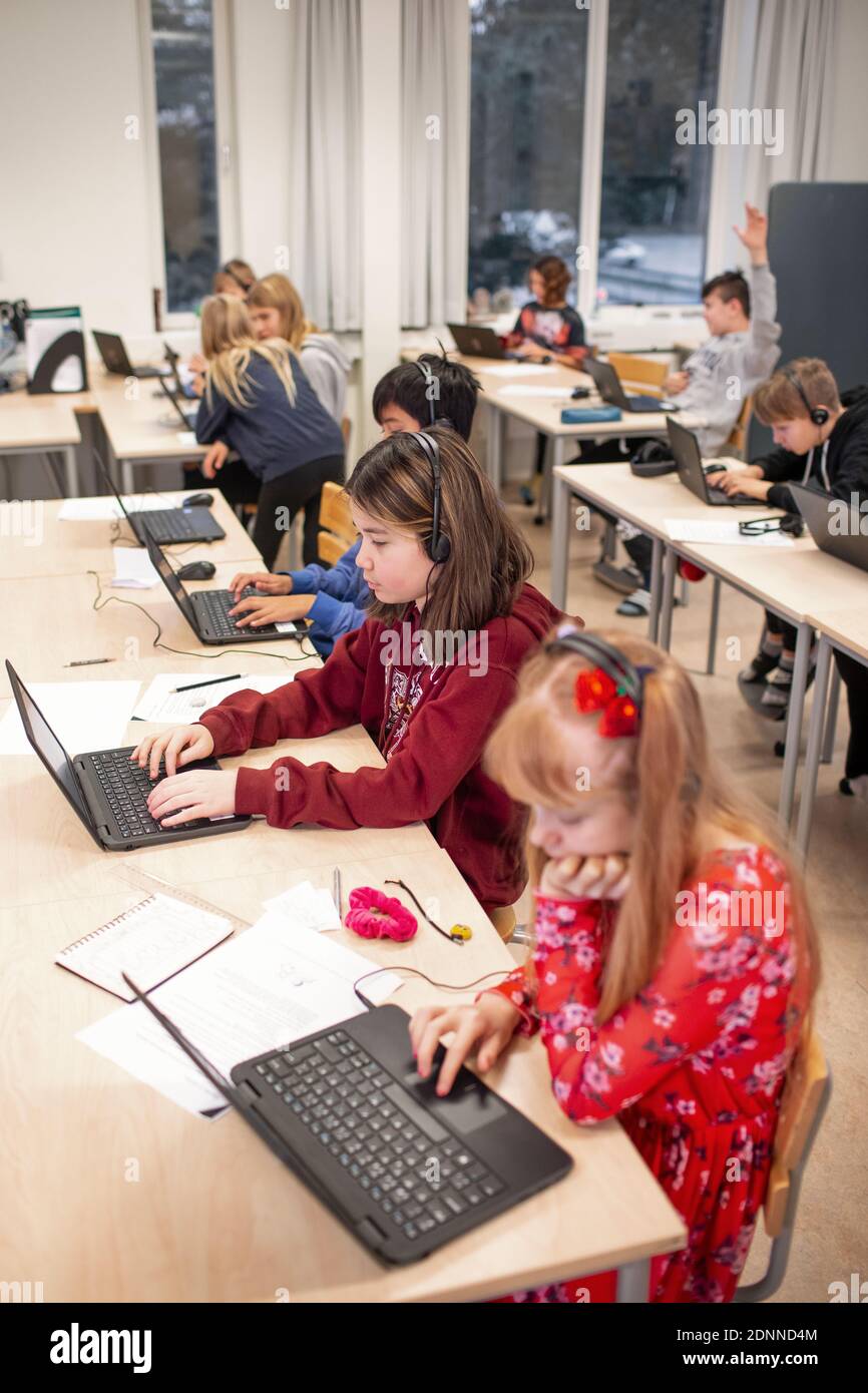 Children in classroom using laptops Stock Photo - Alamy