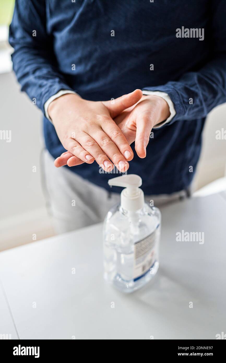 Person applying hand sanitizer Stock Photo - Alamy
