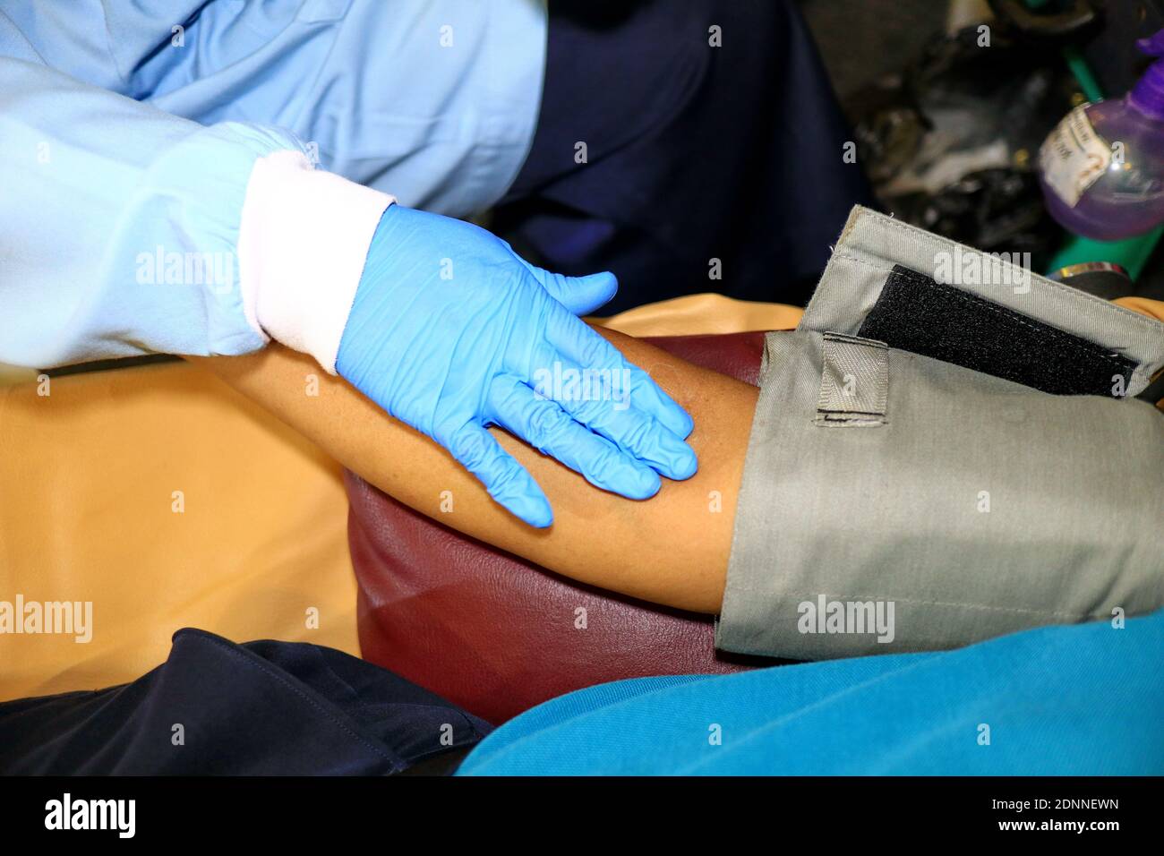 Blood donor at donation, transfusion. Close up right arm of a business ...
