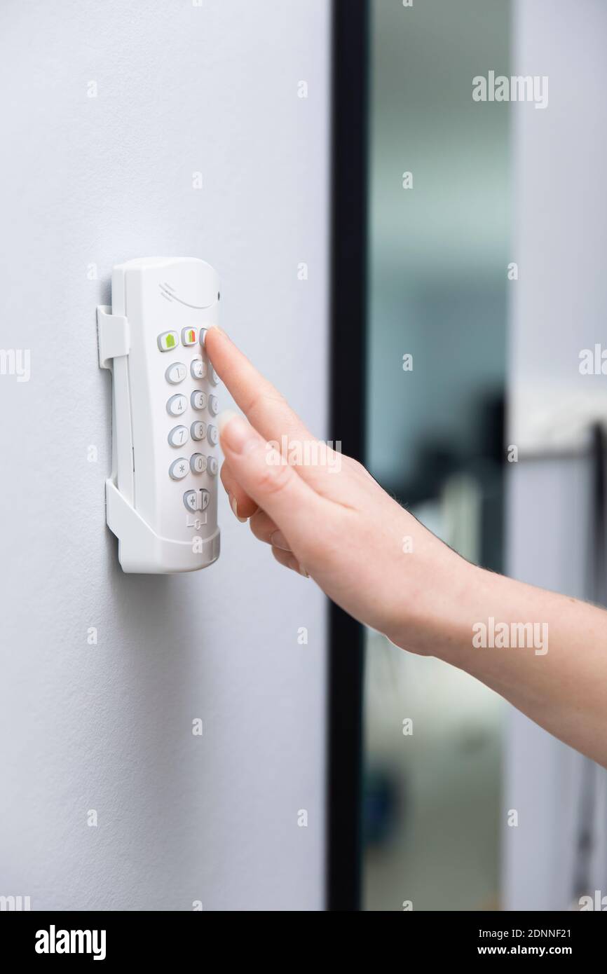 Hand entering code Stock Photo - Alamy