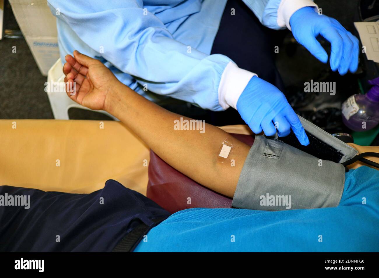 Blood donor at donation, transfusion. Close up right arm of a business ...