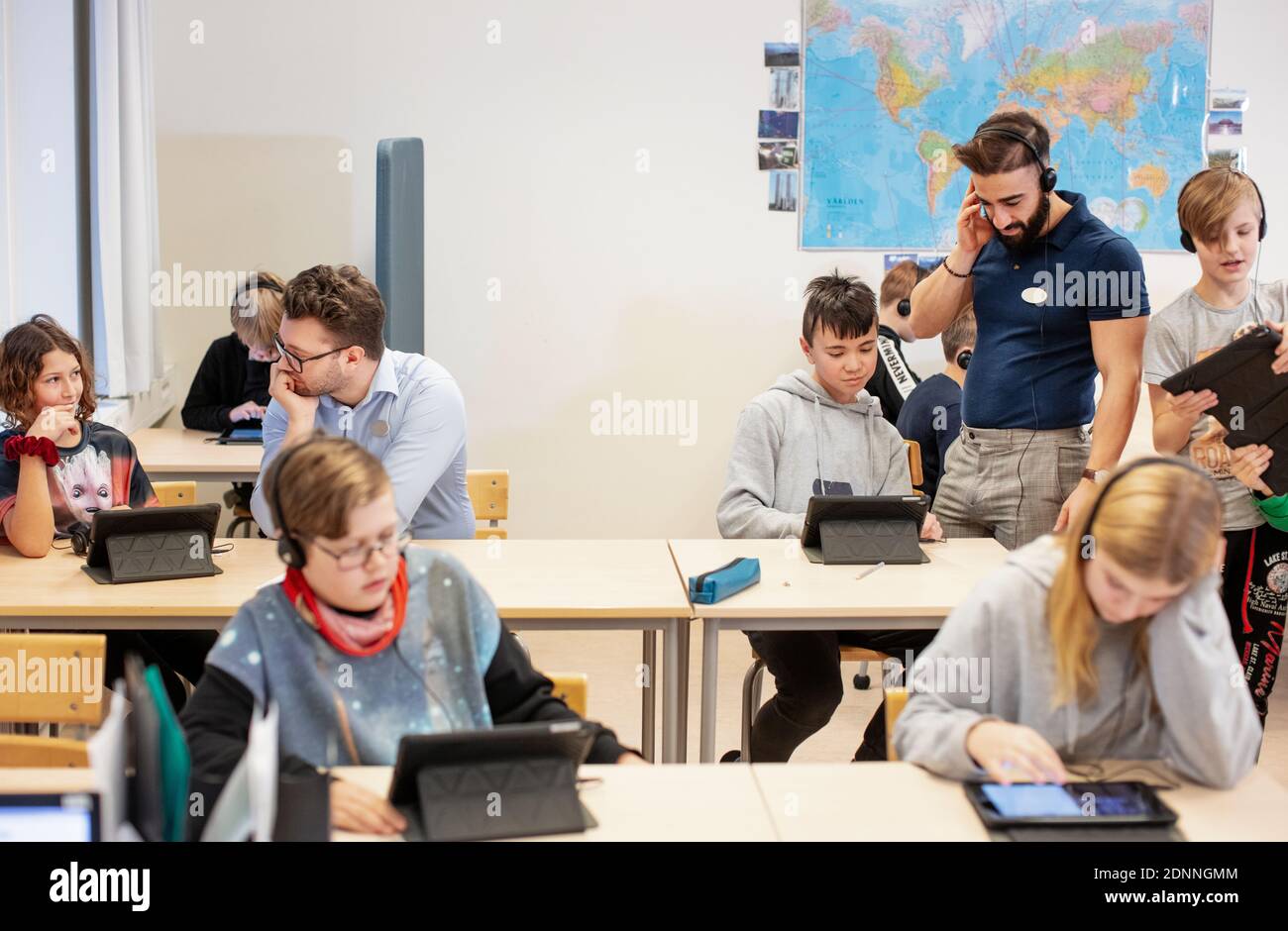 Children in classroom using digital tablet Stock Photo - Alamy