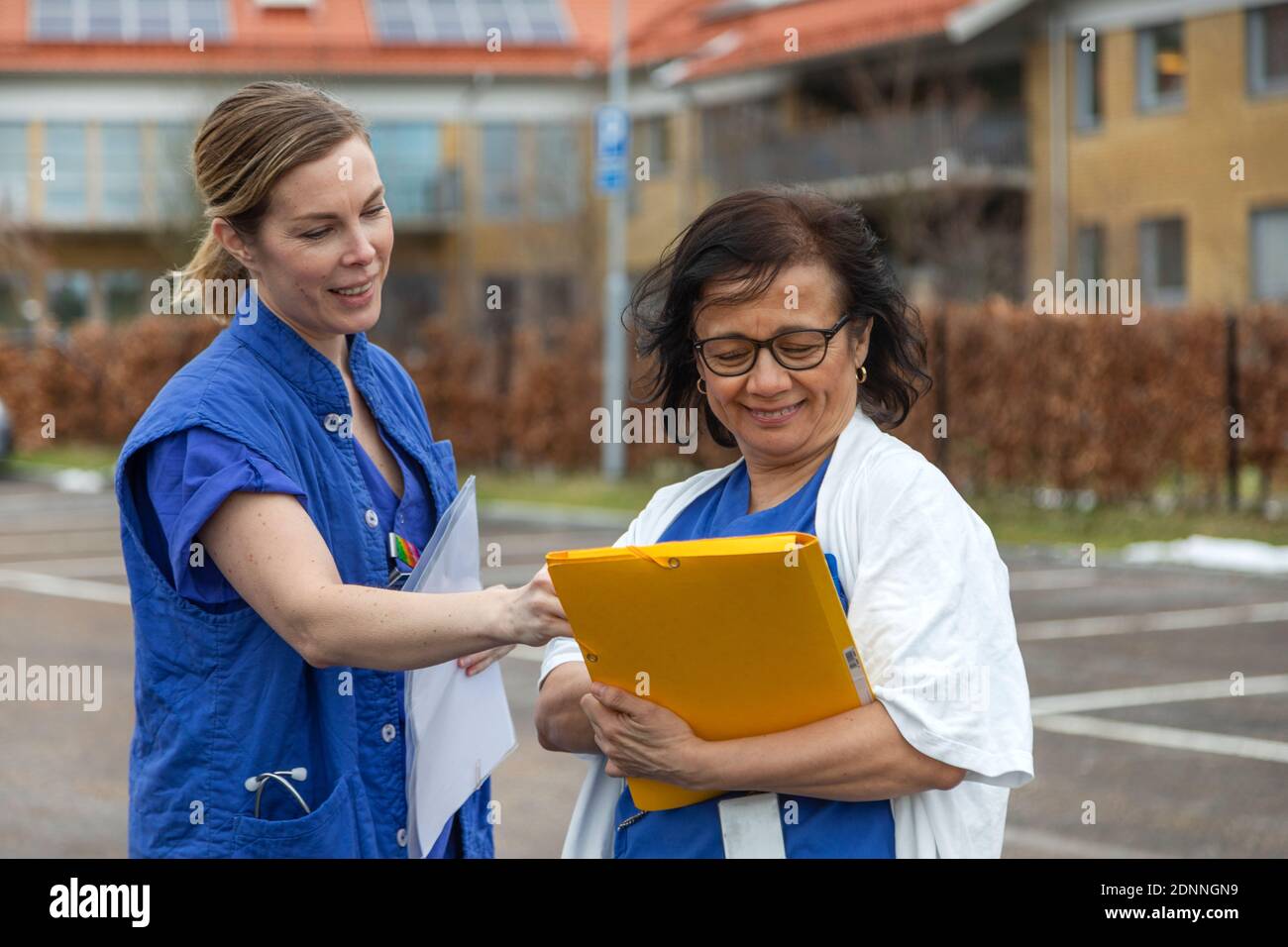 Female doctors talking together Stock Photo - Alamy