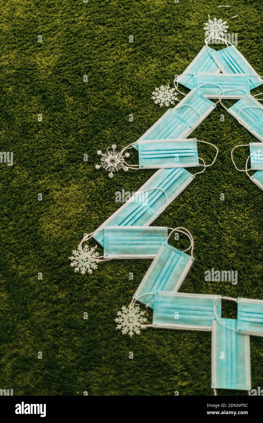 Christmas Tree Made of Medical Masks on a Green Background With Copy ...