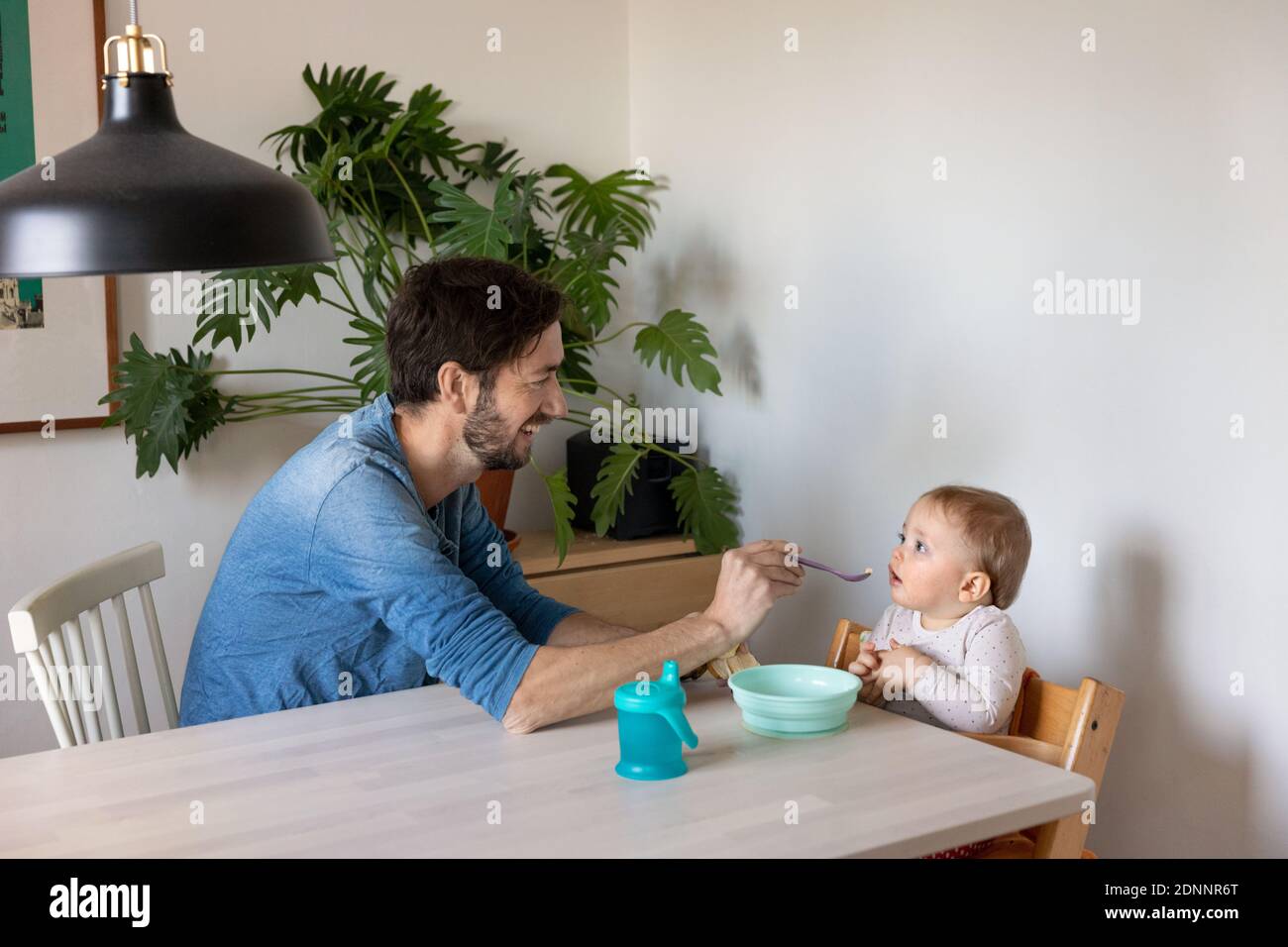Father feed hi-res stock photography and images - Alamy