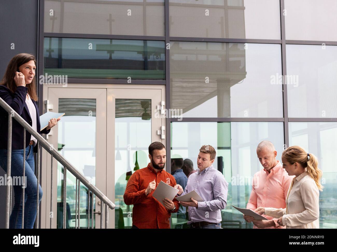 Coworkers talking during break Stock Photo - Alamy