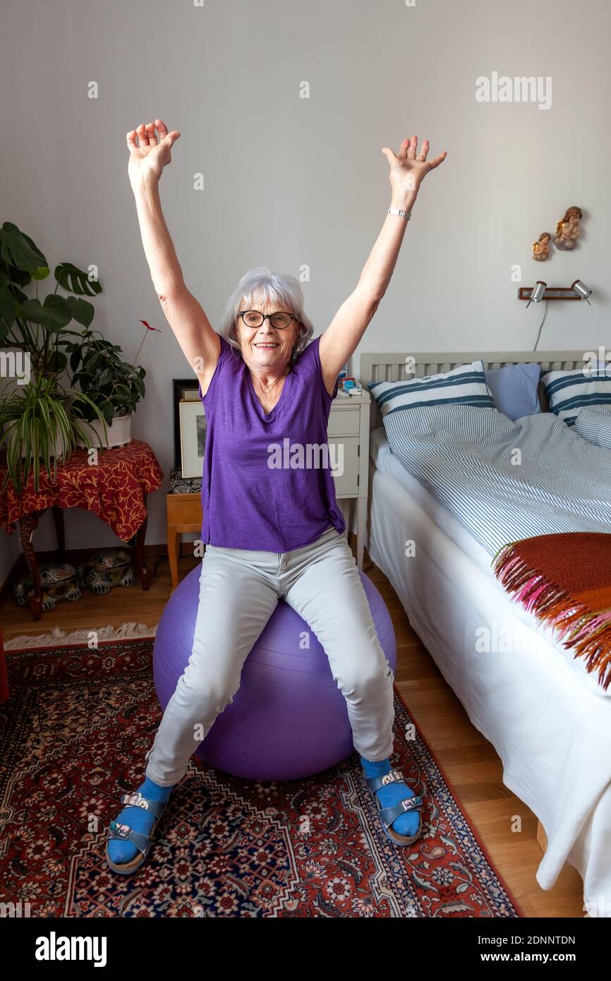 Old woman stretching hi-res stock photography and images - Alamy
