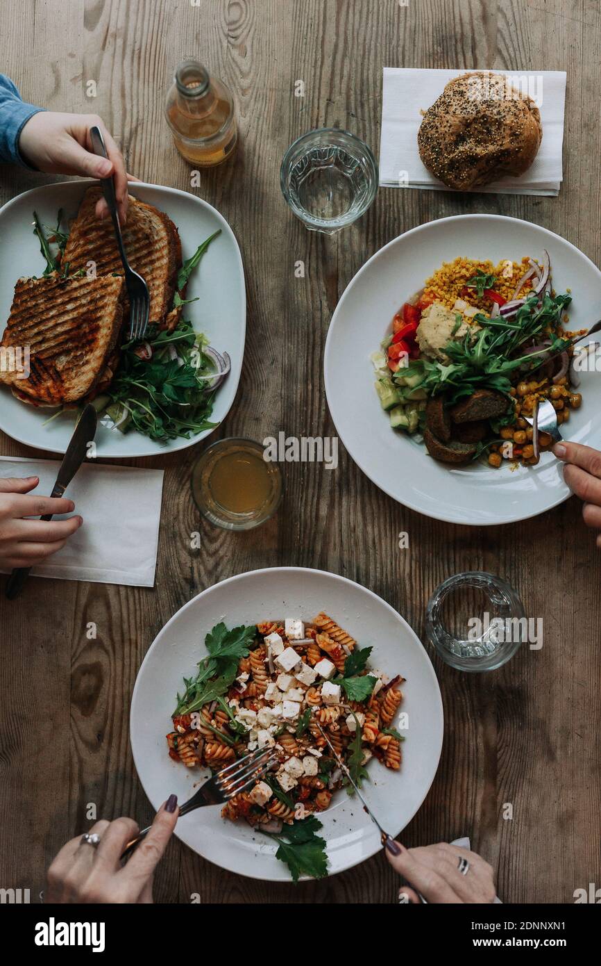 Food on plates in restaurant Stock Photo - Alamy