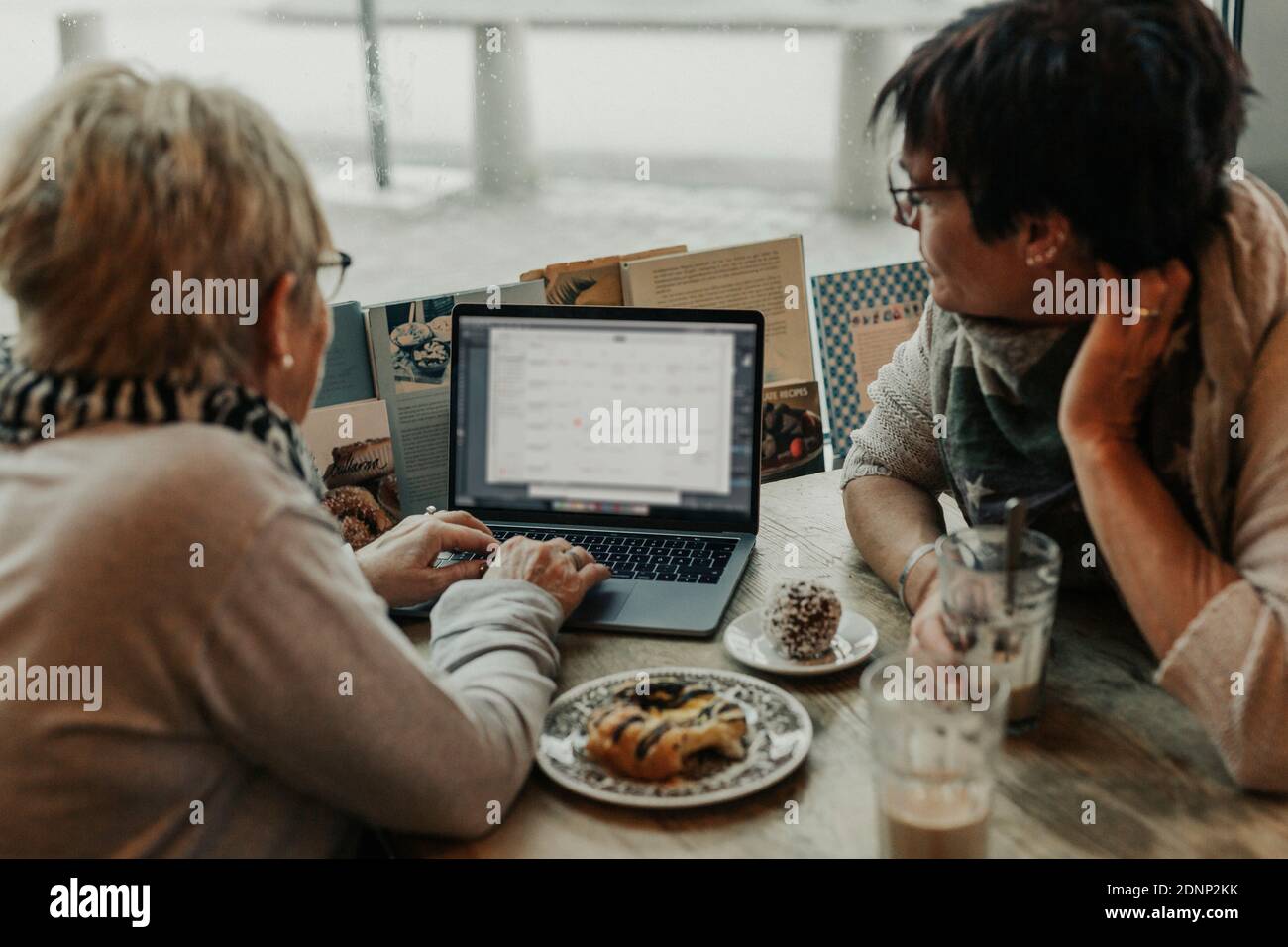 Women using laptop in cafe Stock Photo - Alamy