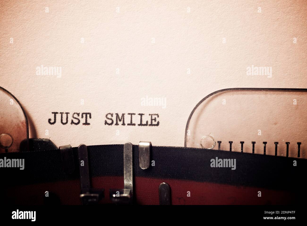 Just smile phrase written with a typewriter Stock Photo - Alamy