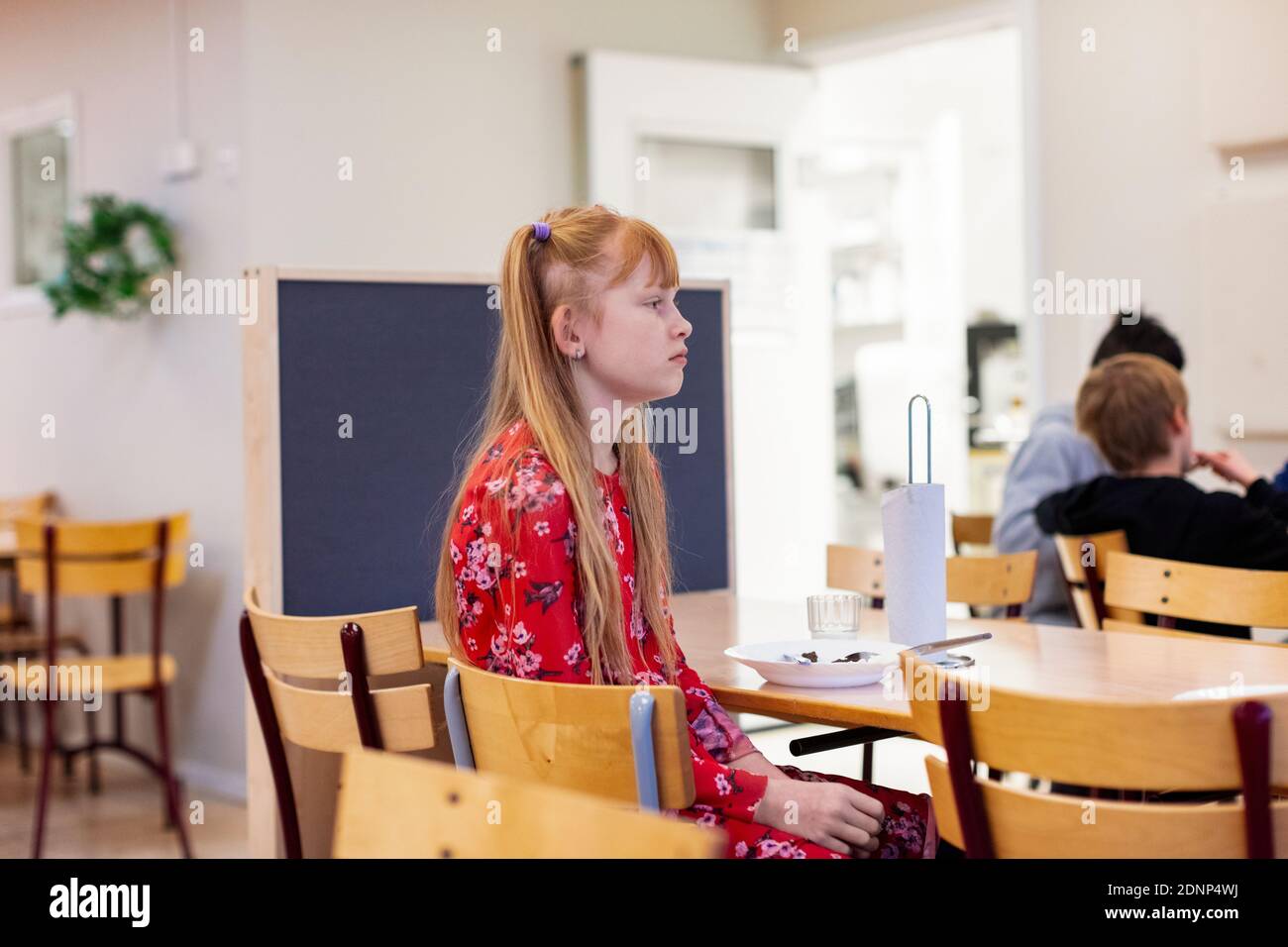 Girl sitting in classroom Stock Photo - Alamy
