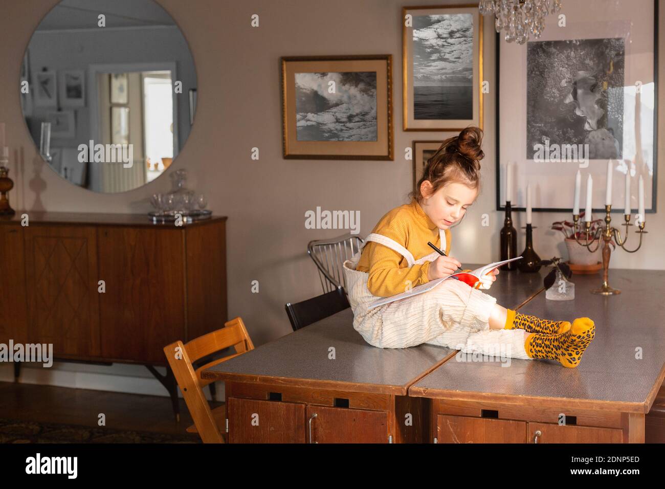 Girl on table hi-res stock photography and images - Alamy