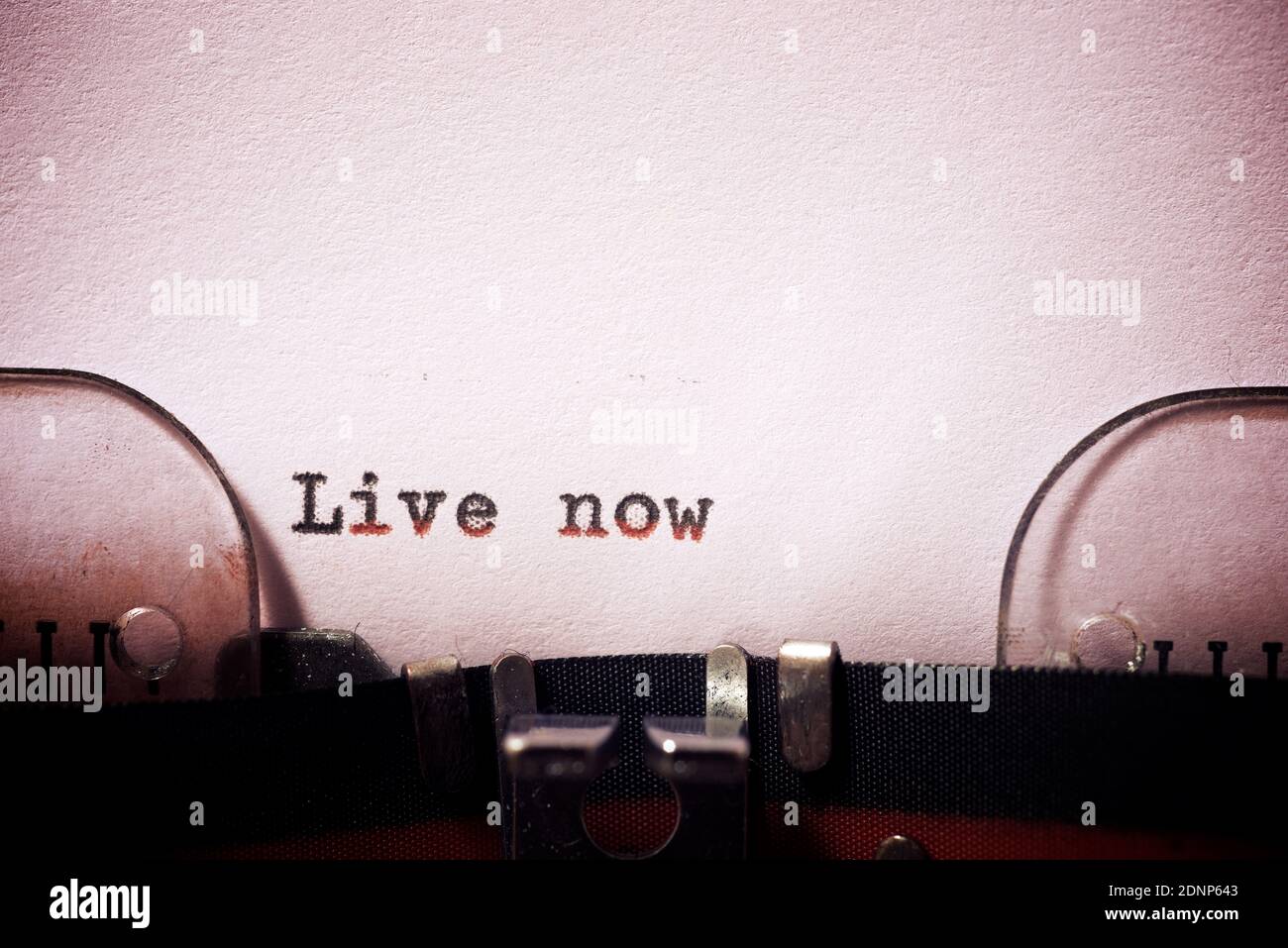 Live now phrase written with a typewriter Stock Photo - Alamy