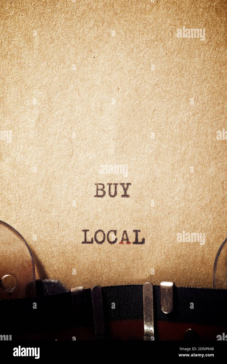 Buy local phrase written with a typewriter Stock Photo - Alamy