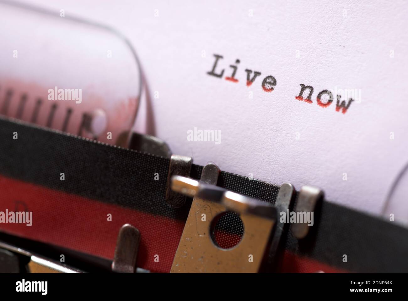 Live now phrase written with a typewriter Stock Photo - Alamy