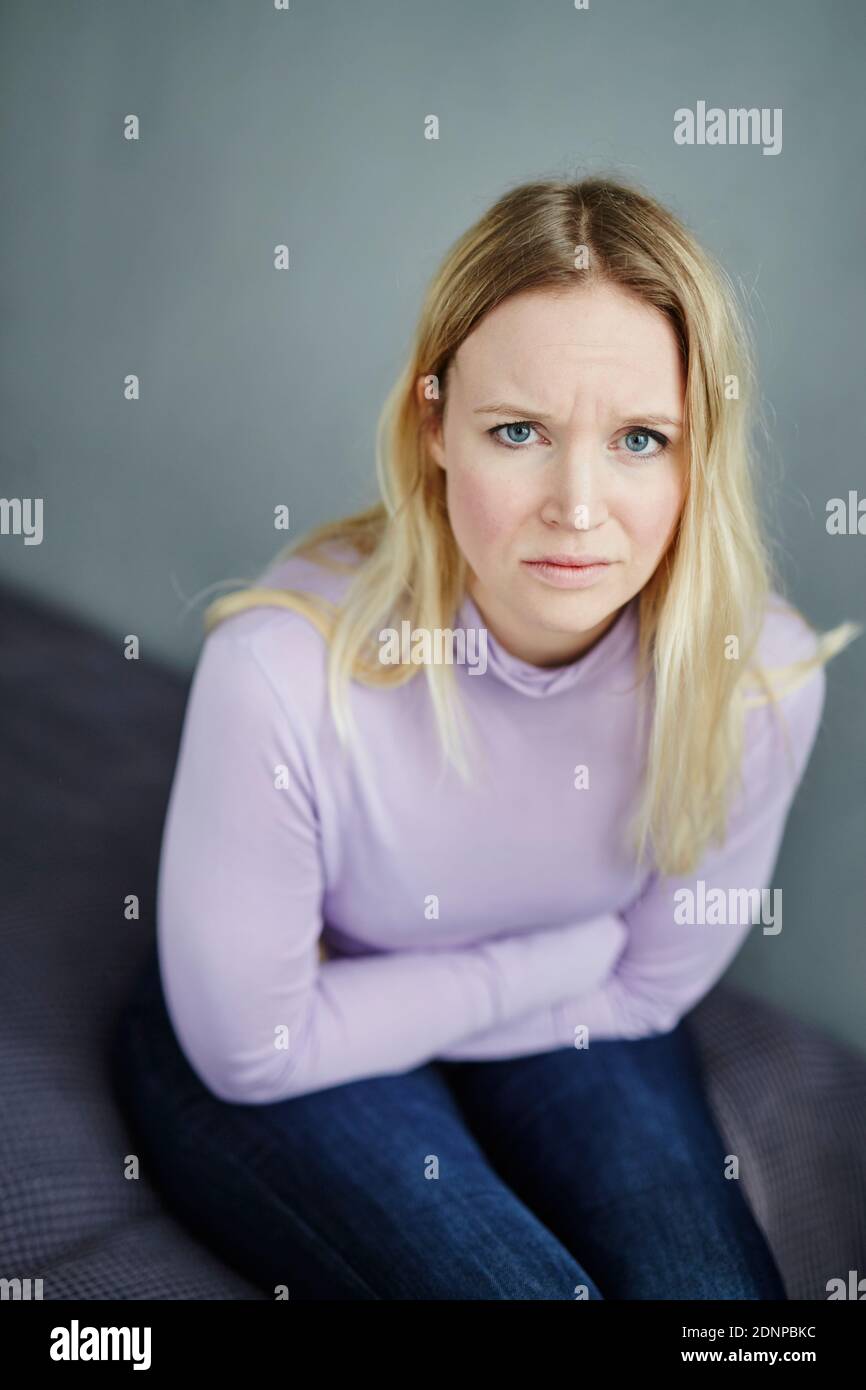 Sad woman looking at camera Stock Photo - Alamy