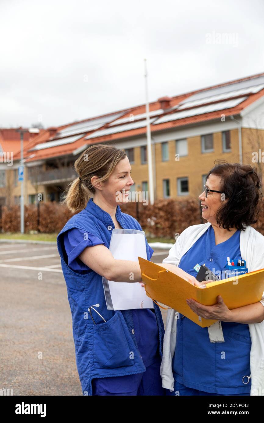 Female doctors talking together Stock Photo - Alamy