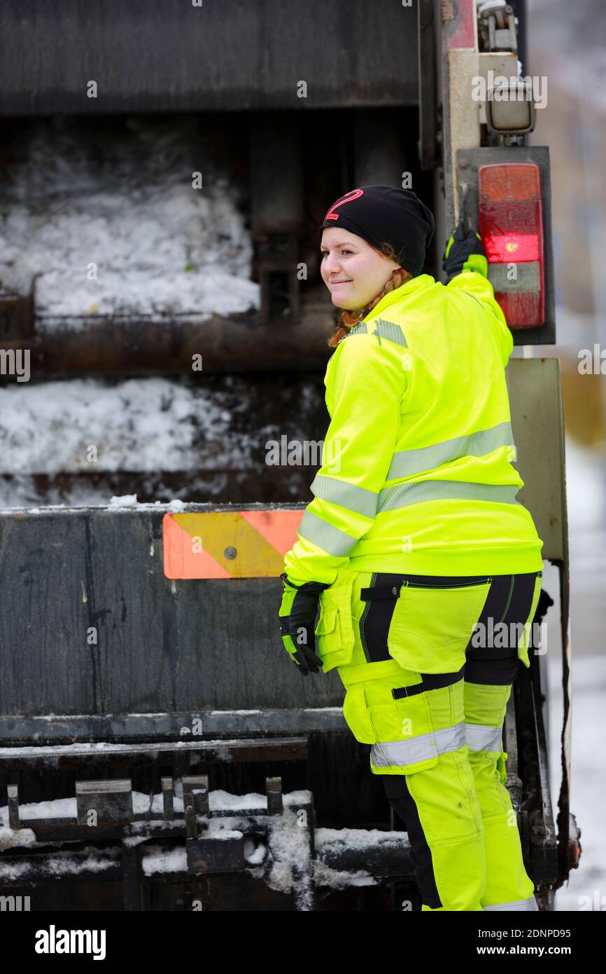 Woman operating garbage truck Stock Photo - Alamy