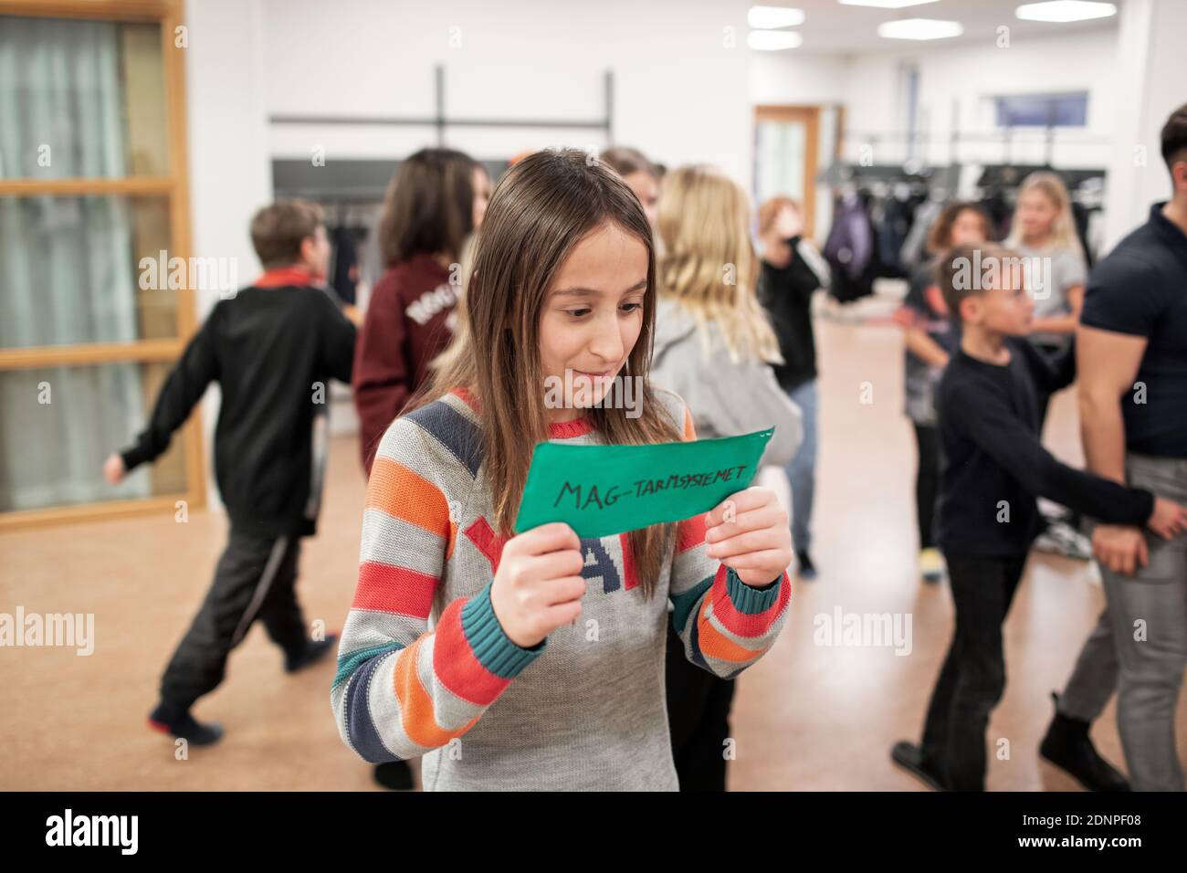 Girl standing at school corridor Stock Photo - Alamy
